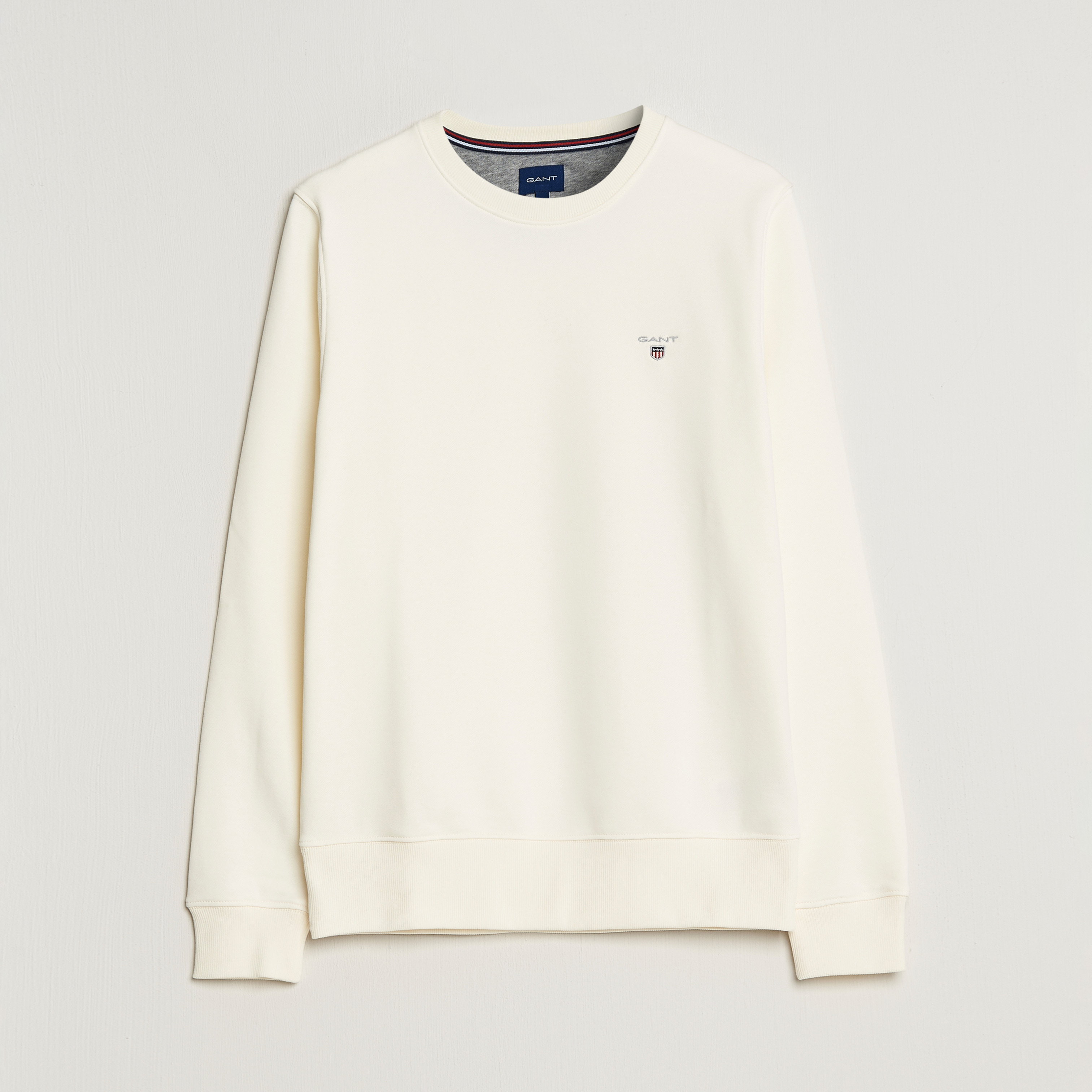 GANT Original Shield Logo Crew Neck Sweatshirt Eggshell at CareOfCarl.com