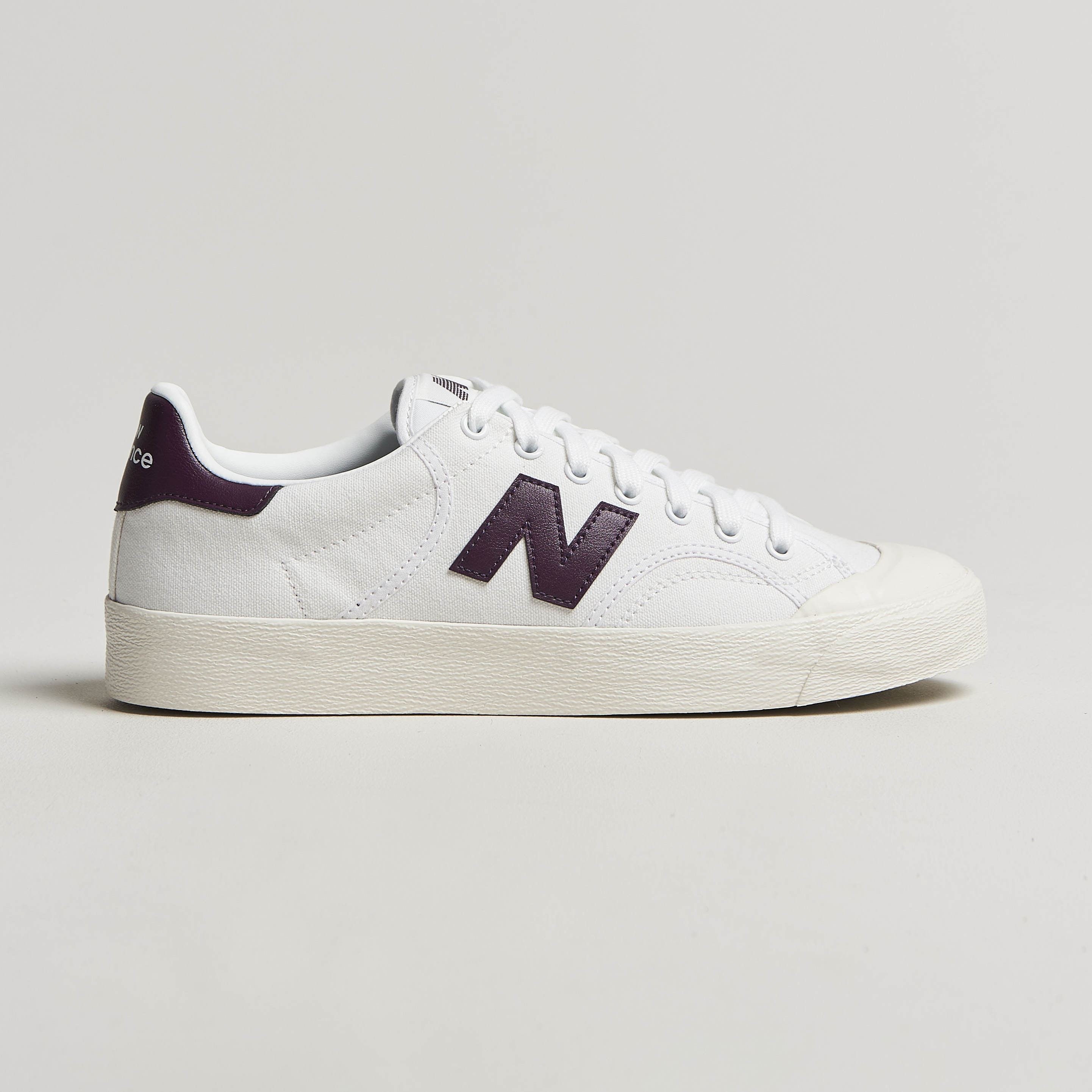 New Balance B100 Sneakers White/Burgundy at CareOfCarl.com